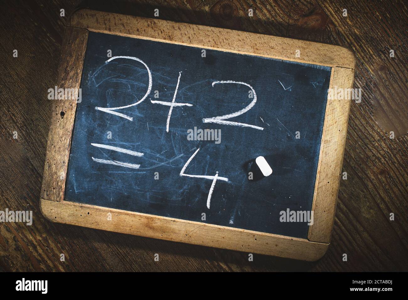 Simple child math calculation with chalk on small blackboard Stock ...