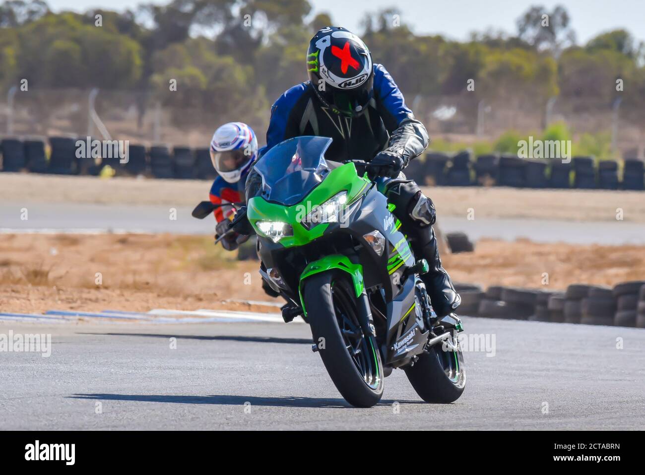 Motorbike racing in circuit. Photographed in Israel Stock Photo - Alamy