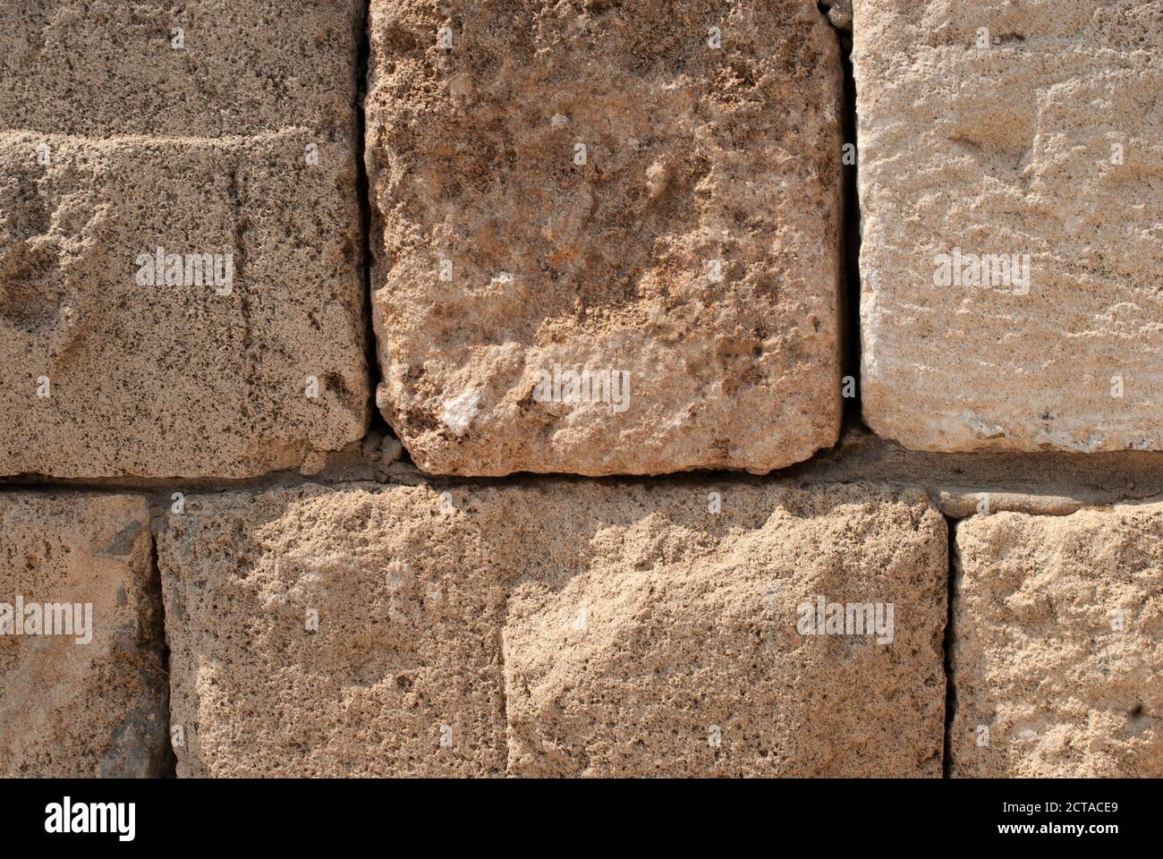 Fragment of old stone wall in one of streets of ancient Jaffa Port ...
