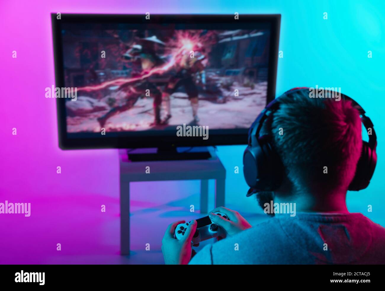 Back view shot of professional gamer playing online video game on his ...