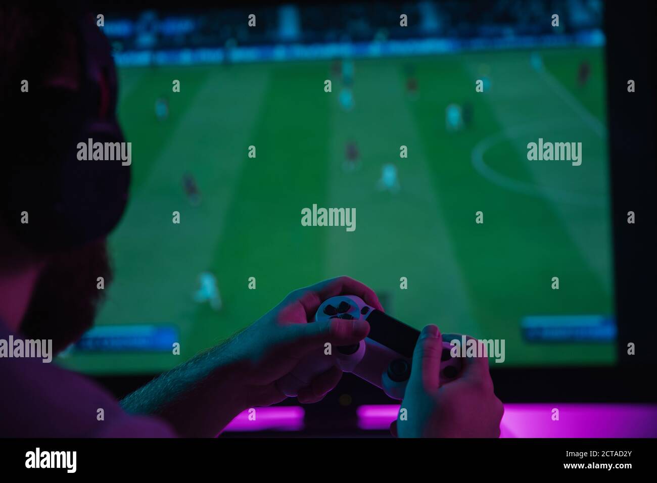 Back view close up of professional gamer playing online video game with ...