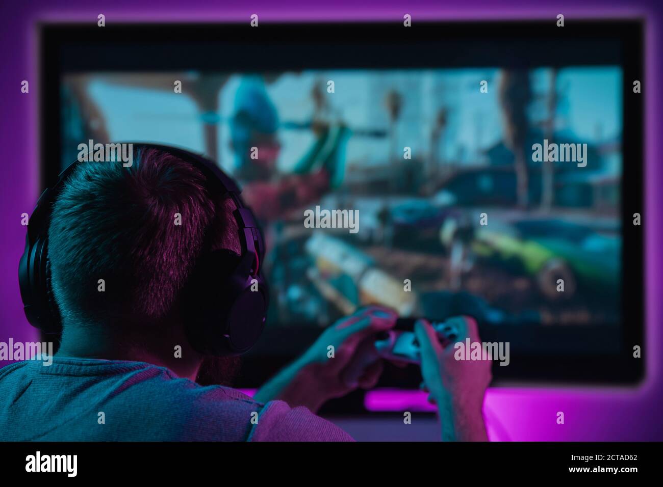 Back view shot of professional gamer playing online video game on his ...