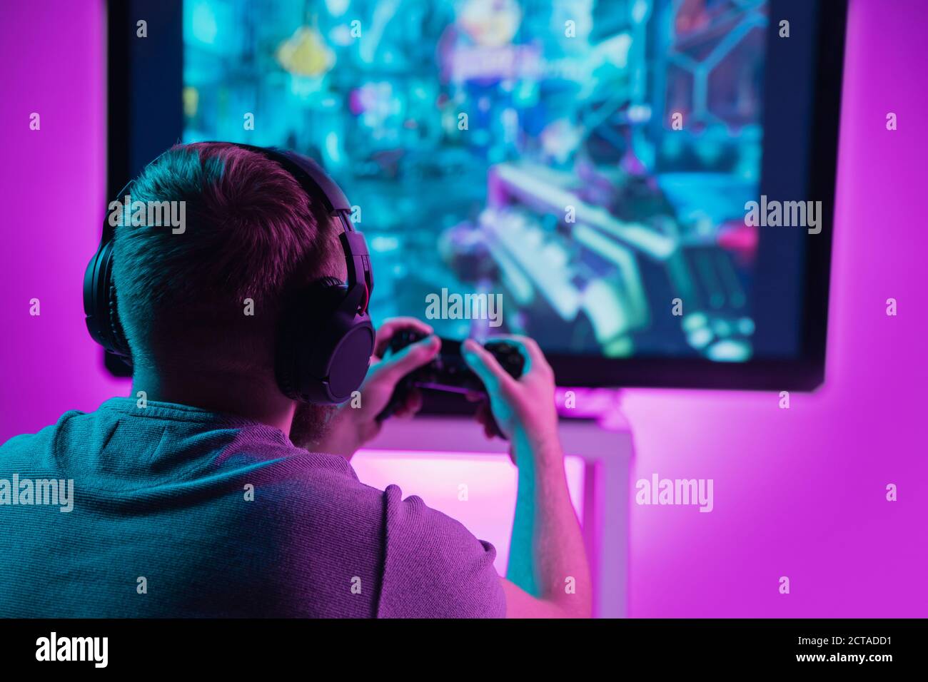 Back view shot of professional gamer playing online video game on his ...