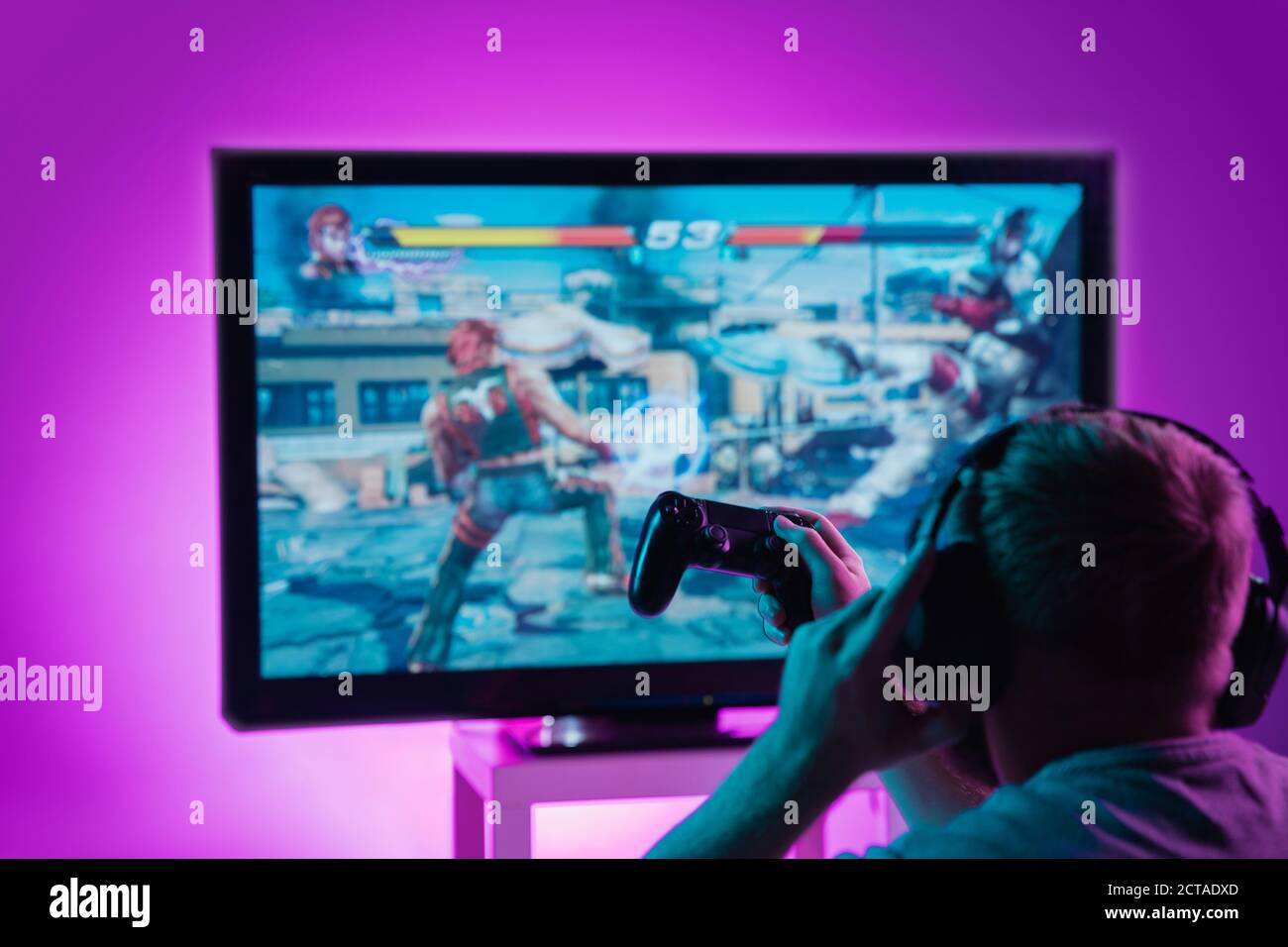 Back view shot of professional gamer playing online video game on his ...