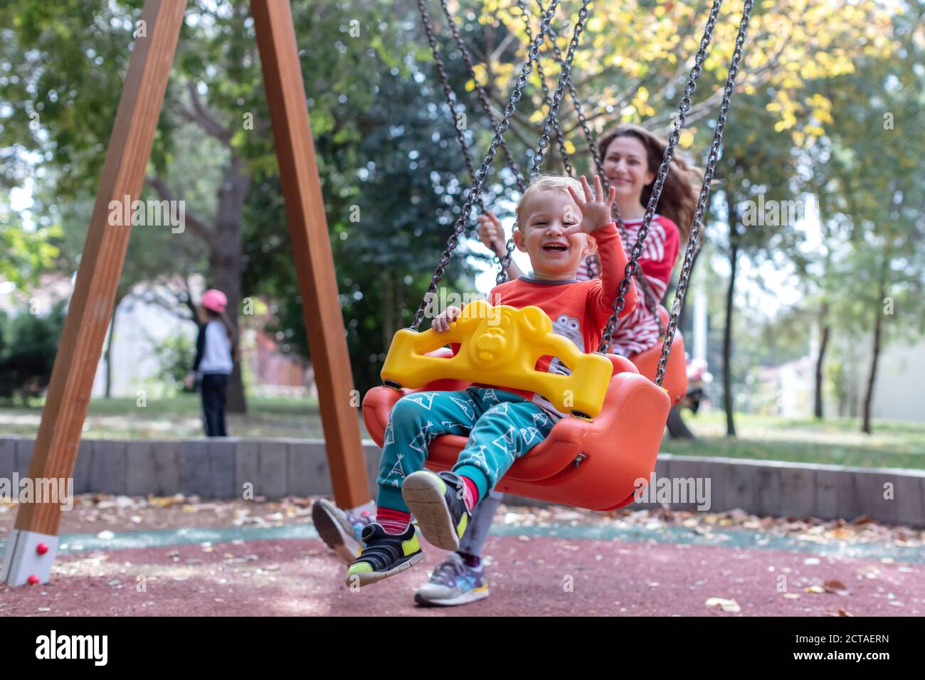 Mother with Child Having Fun Swinging Together at Playground Stock ...