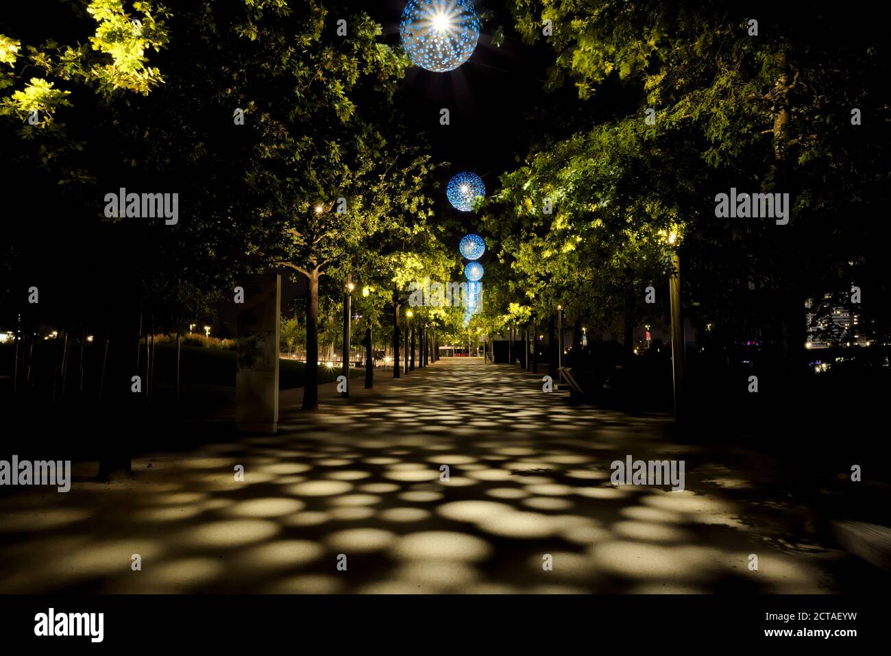 A beautiful park scene in the night with street lights Stock Photo - Alamy