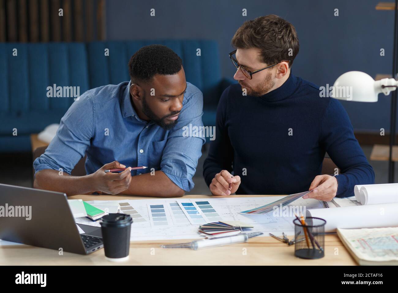 Multiracial engineer team working in office with color palette ...
