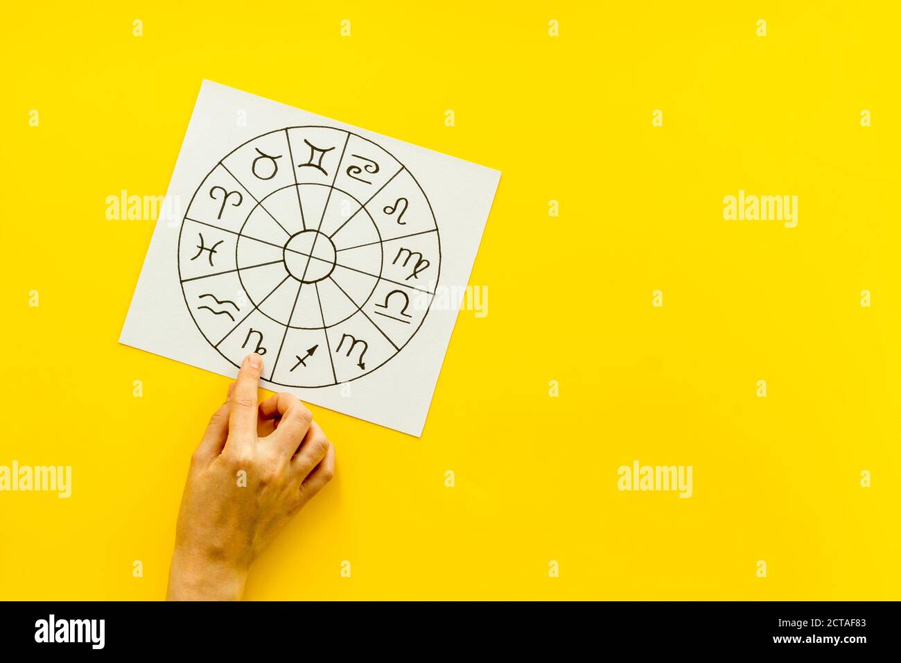 Astrological horoscope with female hand choosing Zodiac signs Stock ...