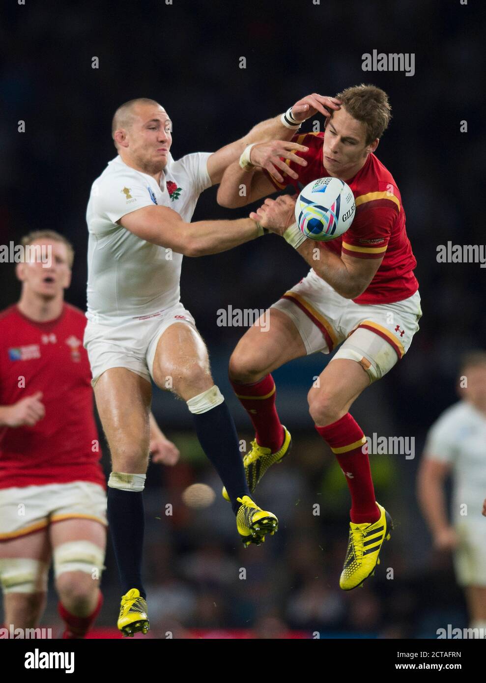 Mike Brown challenges for an aerial ball with Liam Williams England v ...