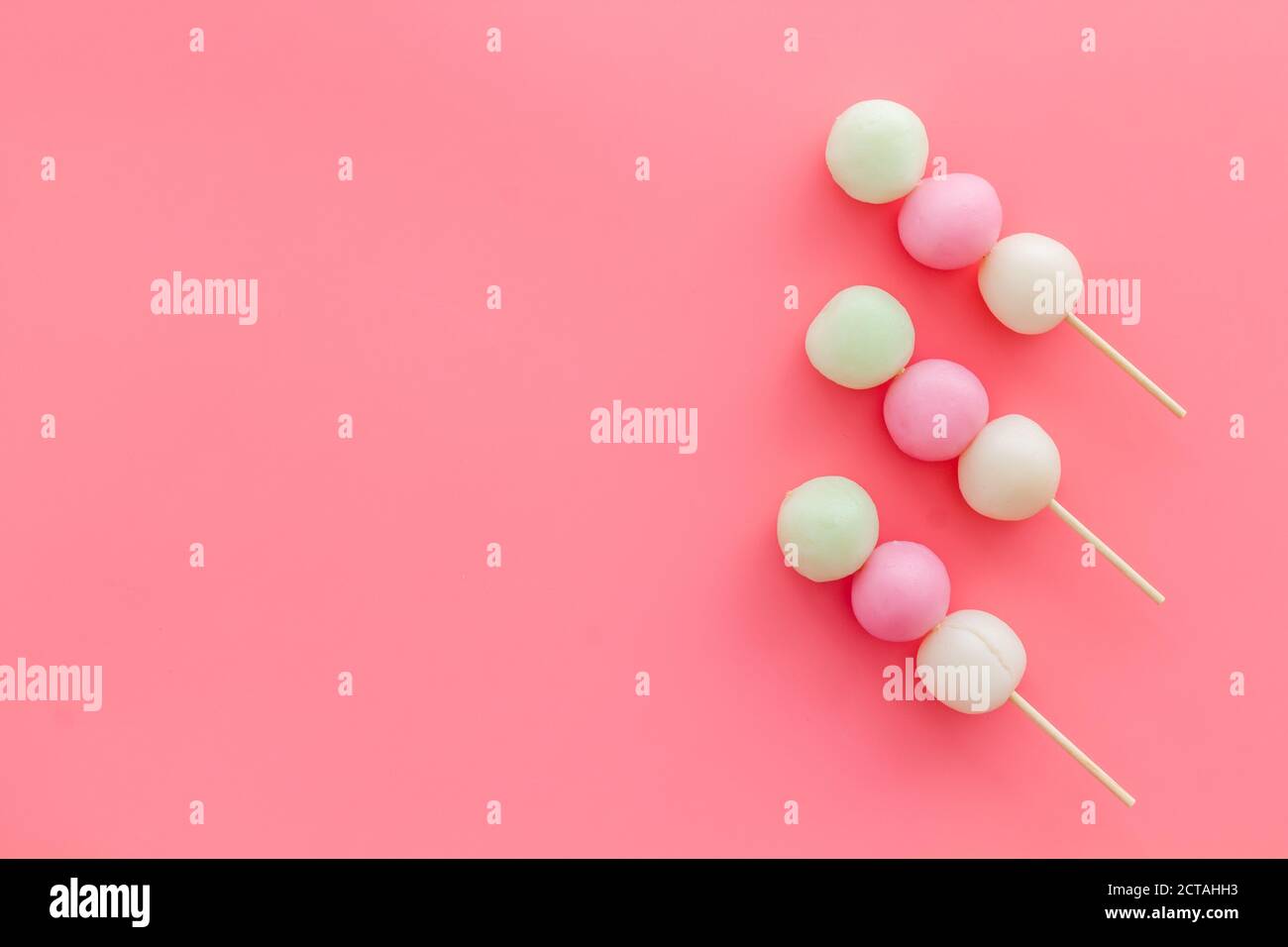Japanese Dango dessert in pink, white and green colors, copy space ...