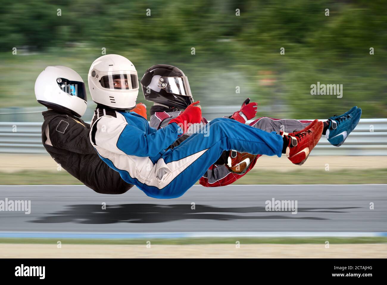 Concept image of racing drivers in racing position with complete gear ...