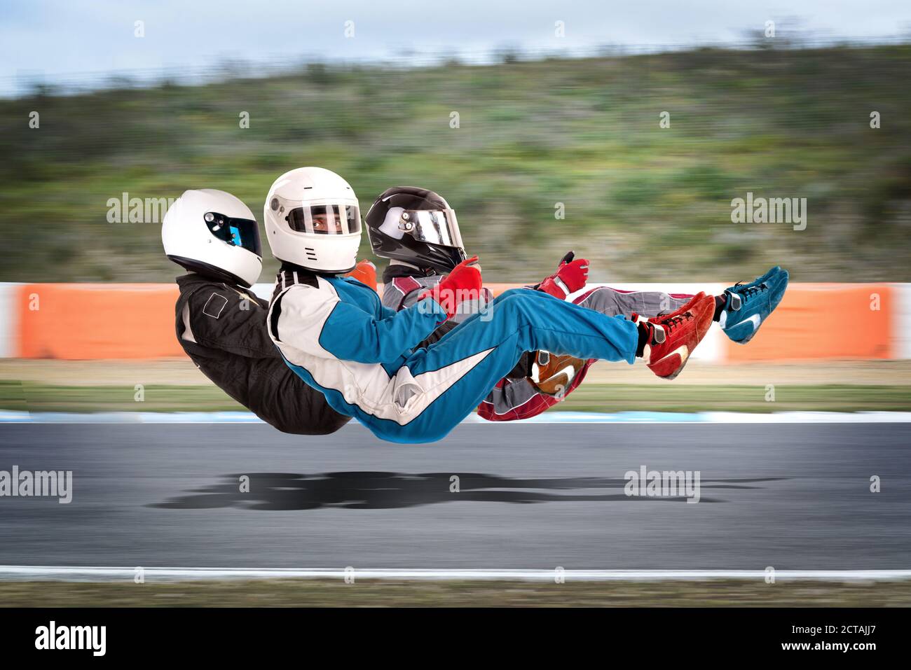 Concept image of racing drivers in racing position with complete gear ...