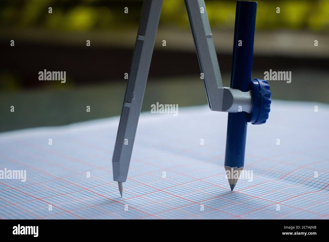 A Compass along with a Pencil Stock Photo - Alamy