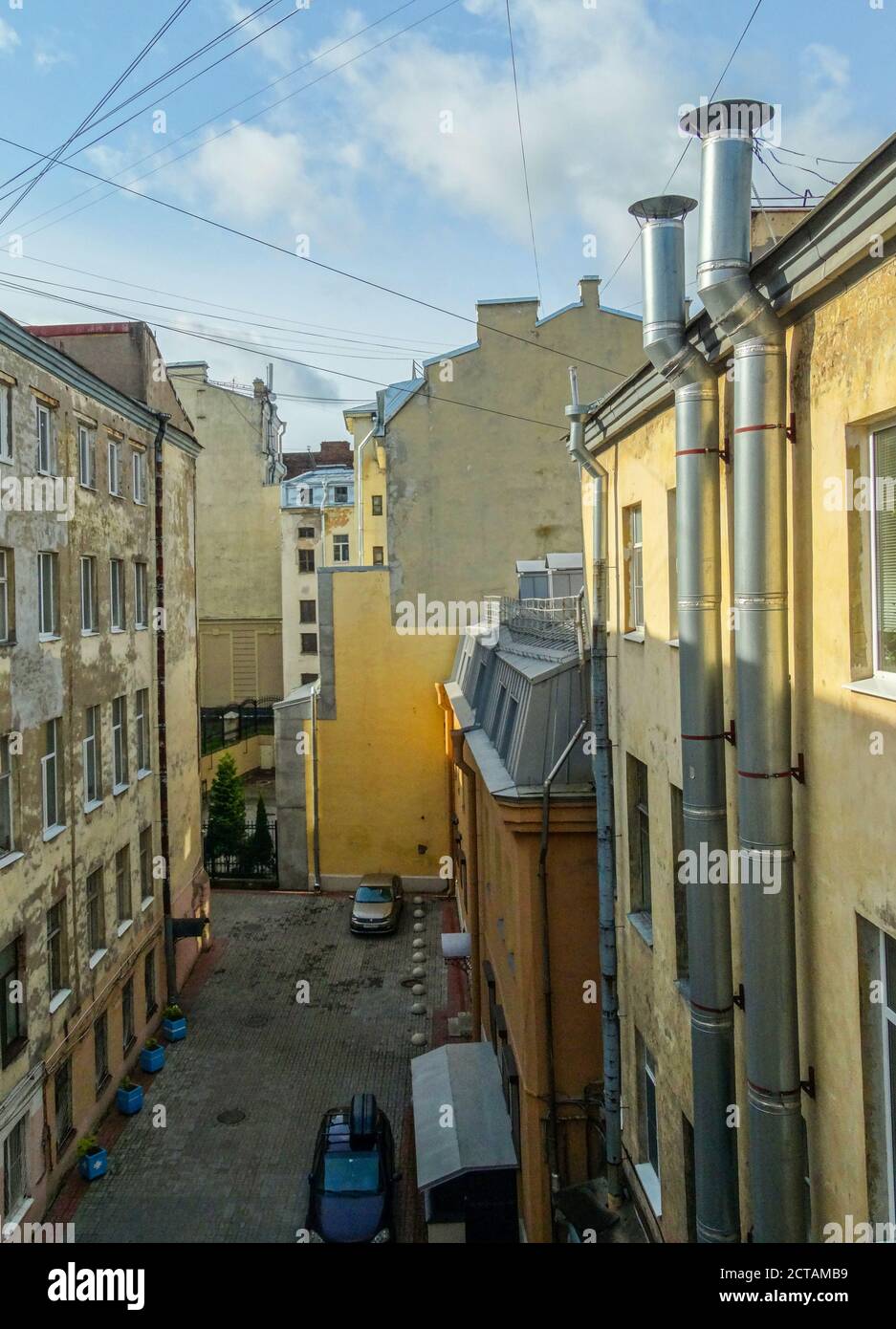 The view from the window onto the courtyard with old dilapidated houses ...