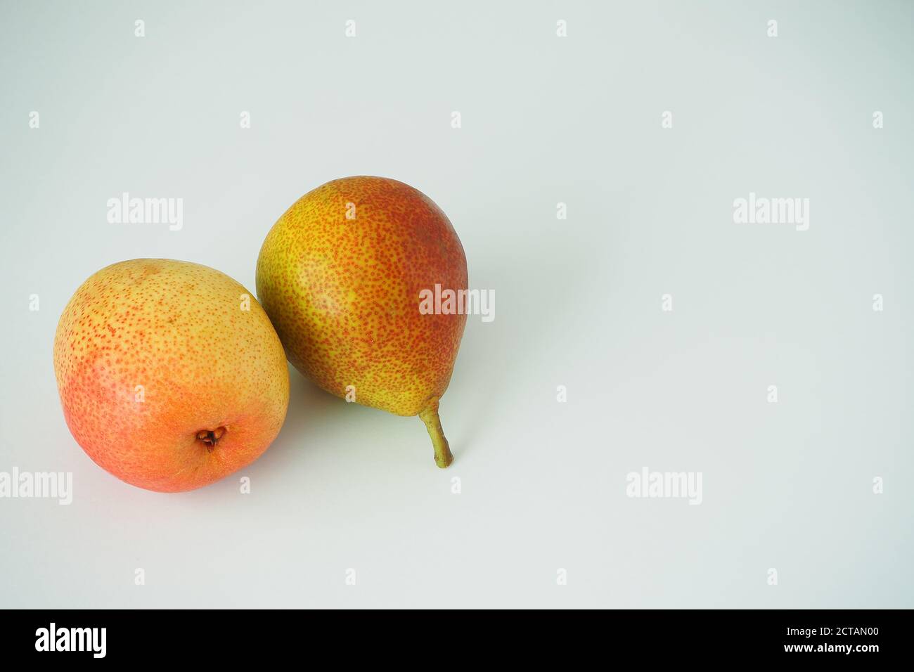 Fruit. Two pears on a white background Stock Photo - Alamy