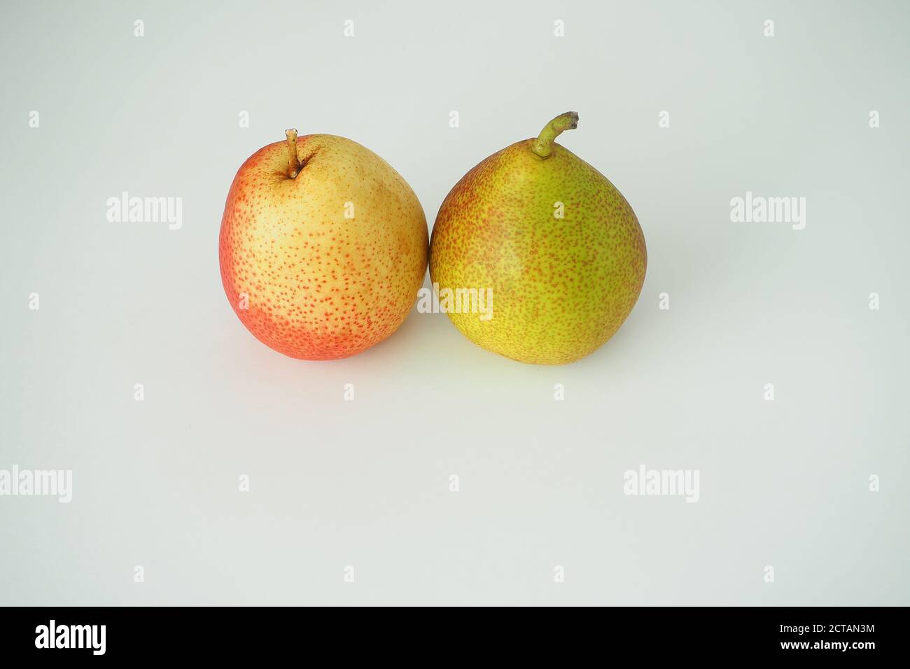 Fruit. Two pears close-up on a white background Stock Photo - Alamy
