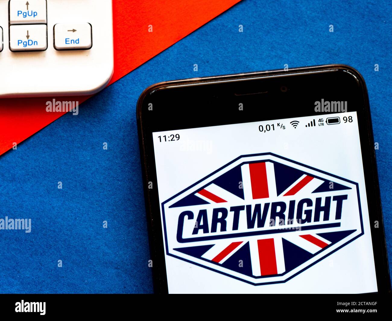 In this photo illustration a Cartwright logo is seen displayed on a ...