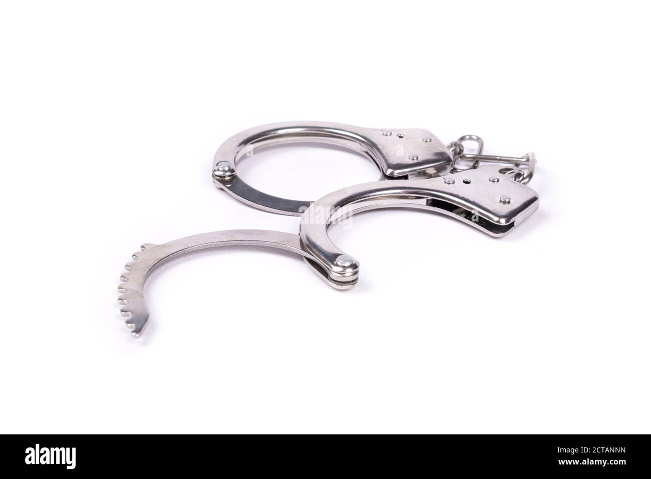 open handcuffs isolated on white background Stock Photo - Alamy