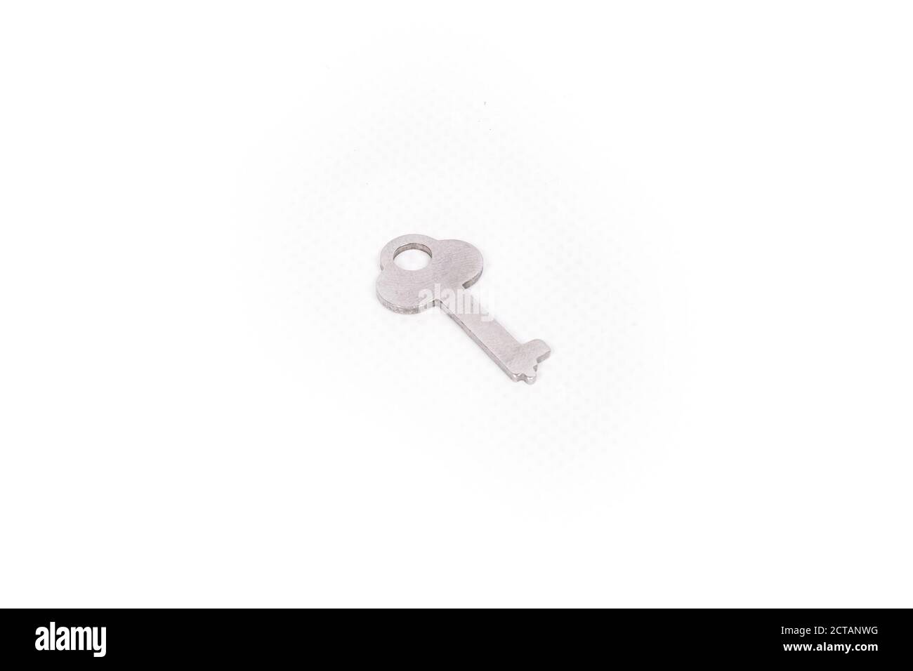 small silver key isolated on white background Stock Photo - Alamy