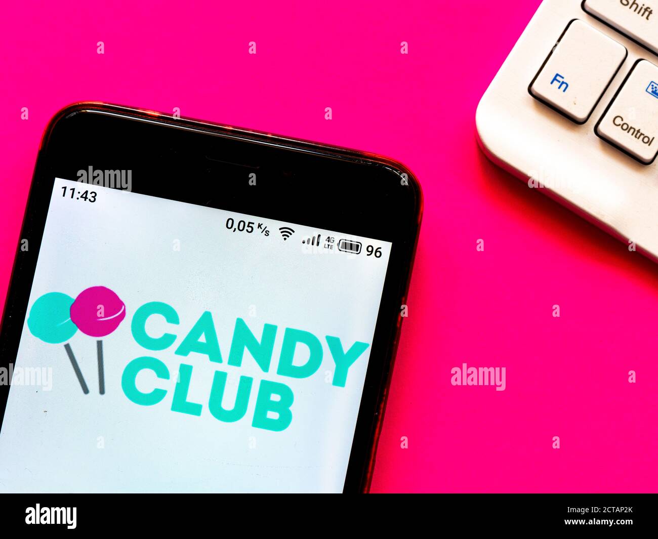 In this photo illustration a Candy Club logo is seen displayed on a ...