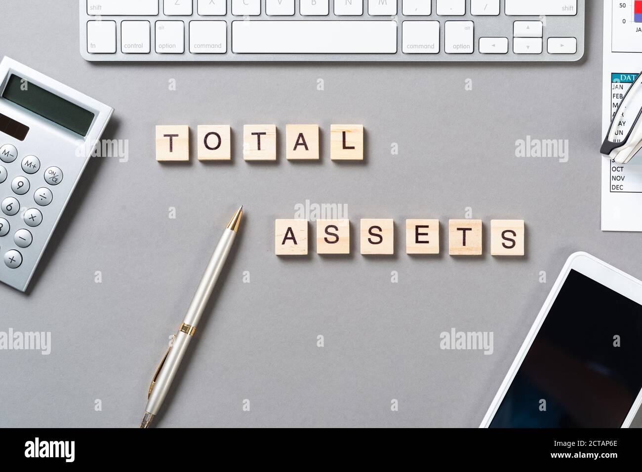 Total assets concept with letters on cubes Stock Photo - Alamy