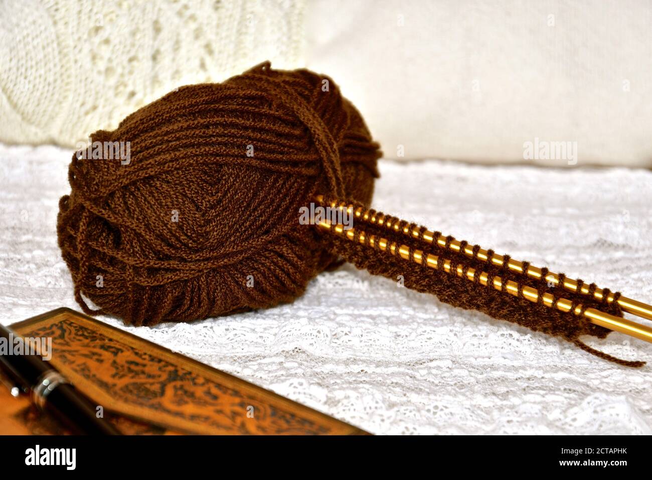 Concept of relaxation with knitting and journal in a still life ...