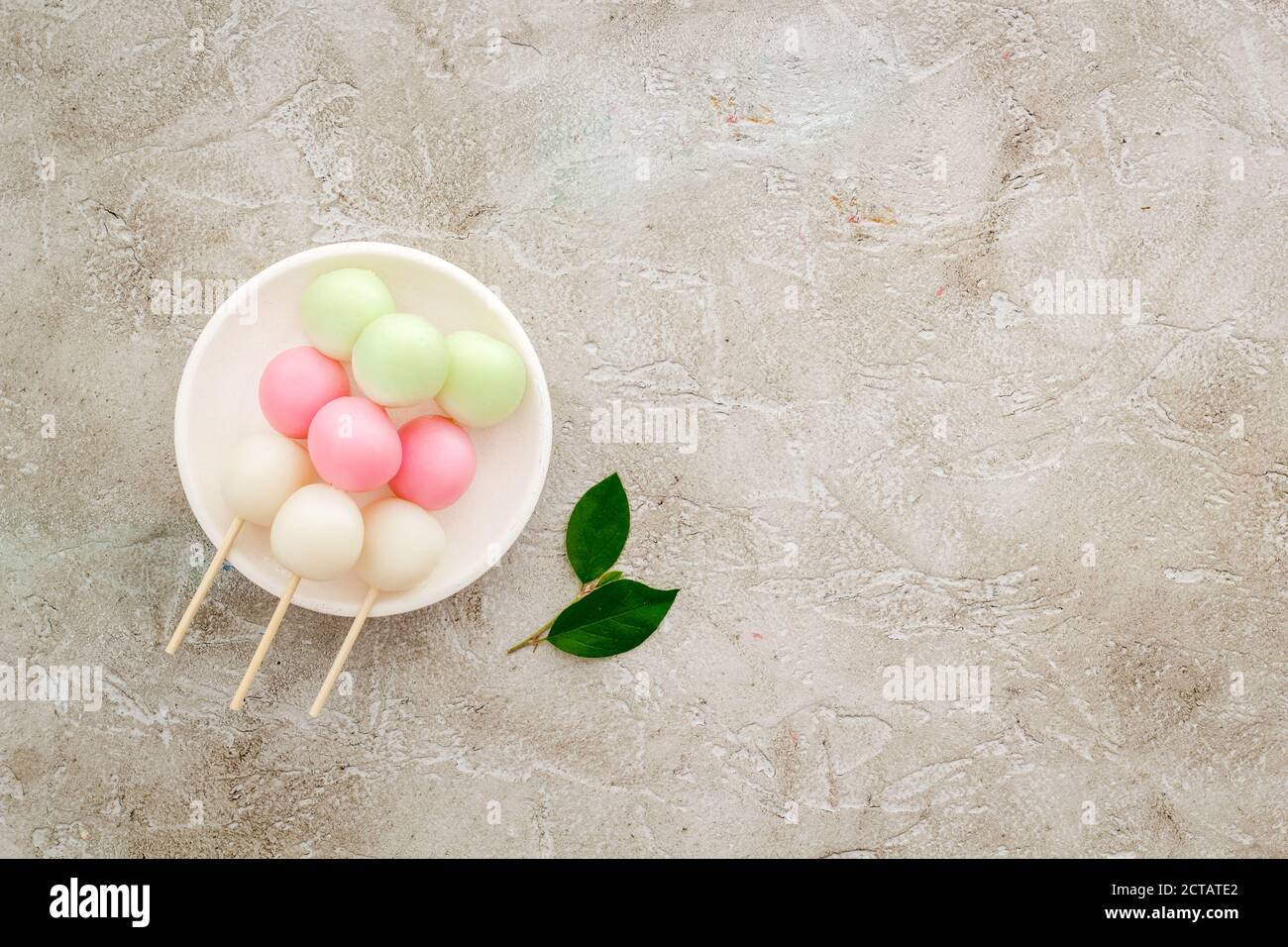 Japanese Dango dessert in pink, white and green colors, copy space ...