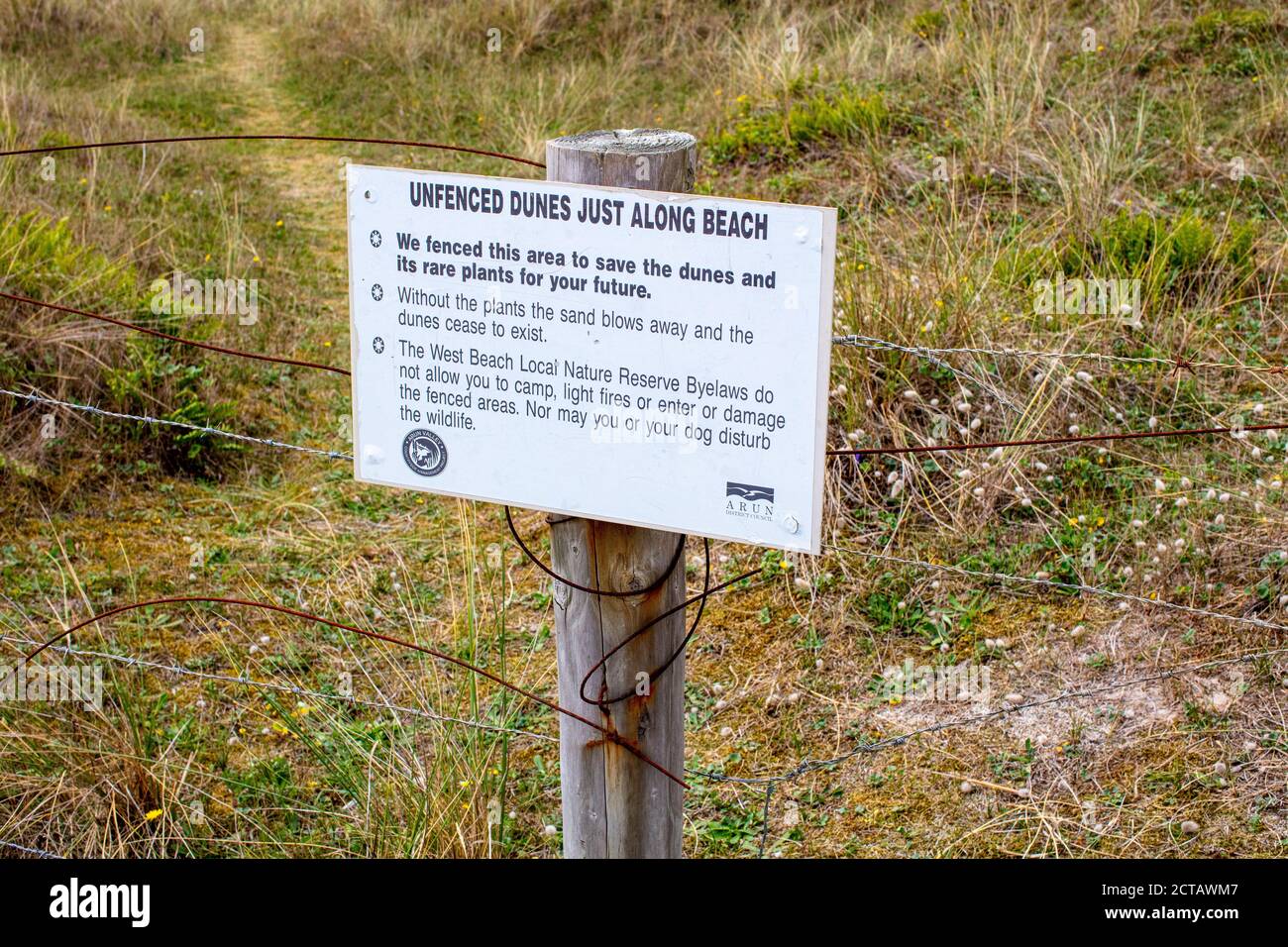 Sign on West Beach indicating unfenced dunes and rare plants ...