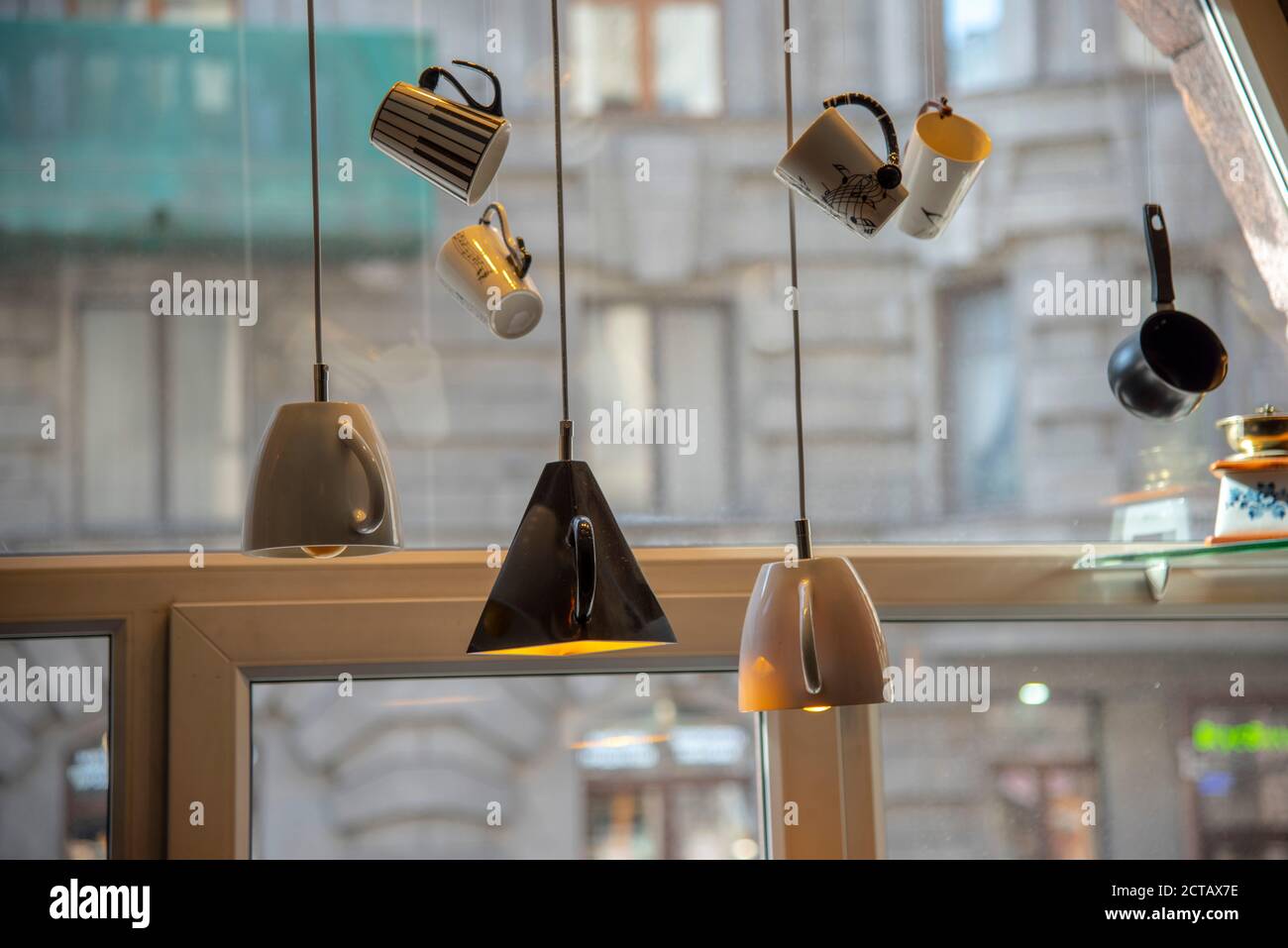 The lights are made out of different cups hanging on the window Stock ...