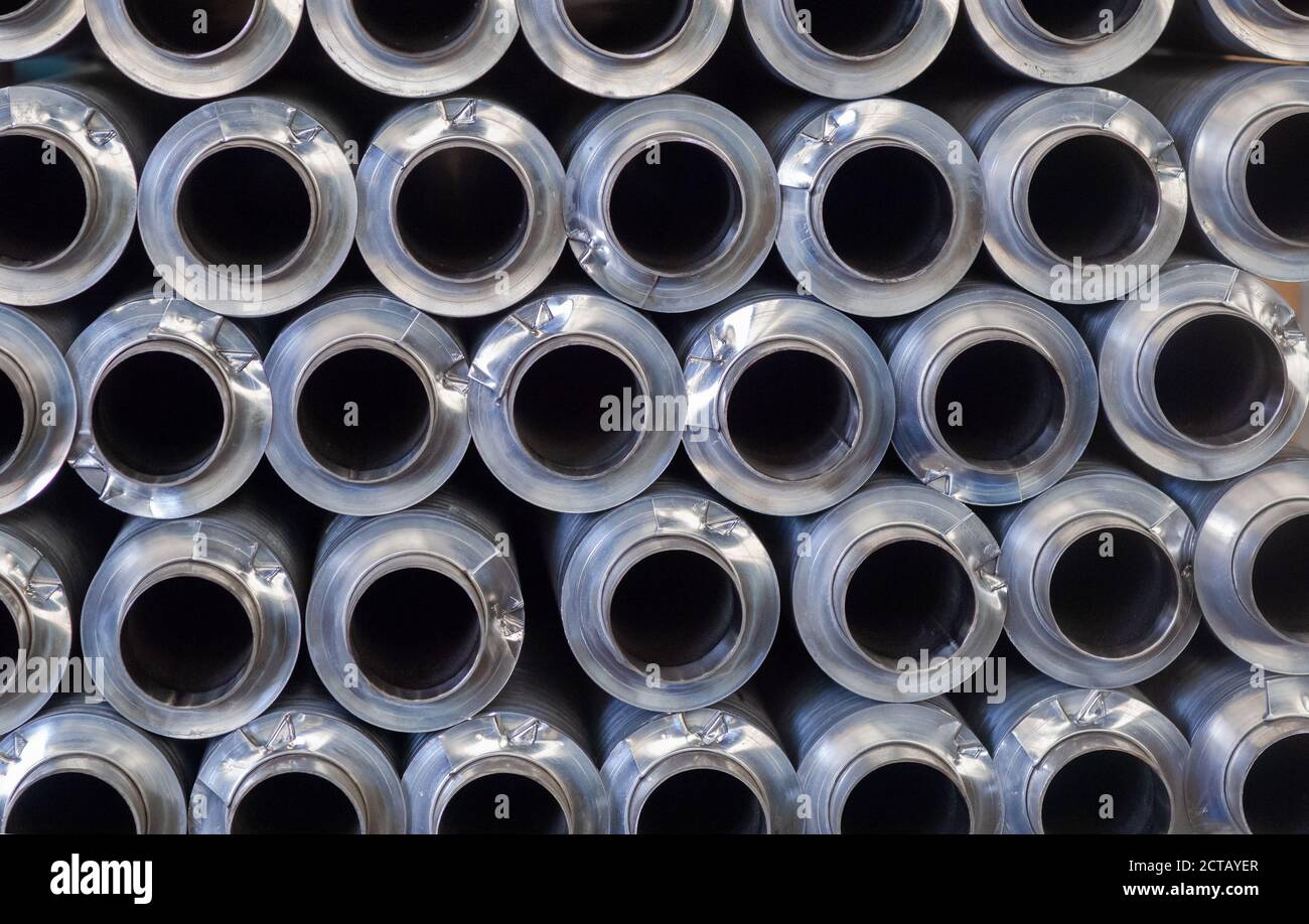 Stacked stainless steel tubes with cooling ribs Stock Photo - Alamy