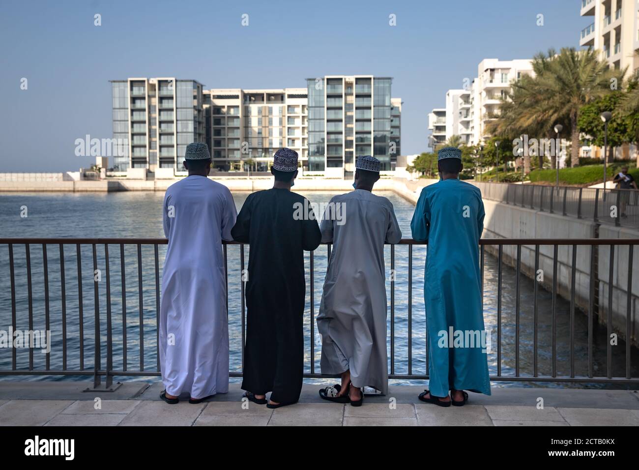 Four Omani men by the marina. Al Mouj, The Wave, Muscat, Oman Stock ...