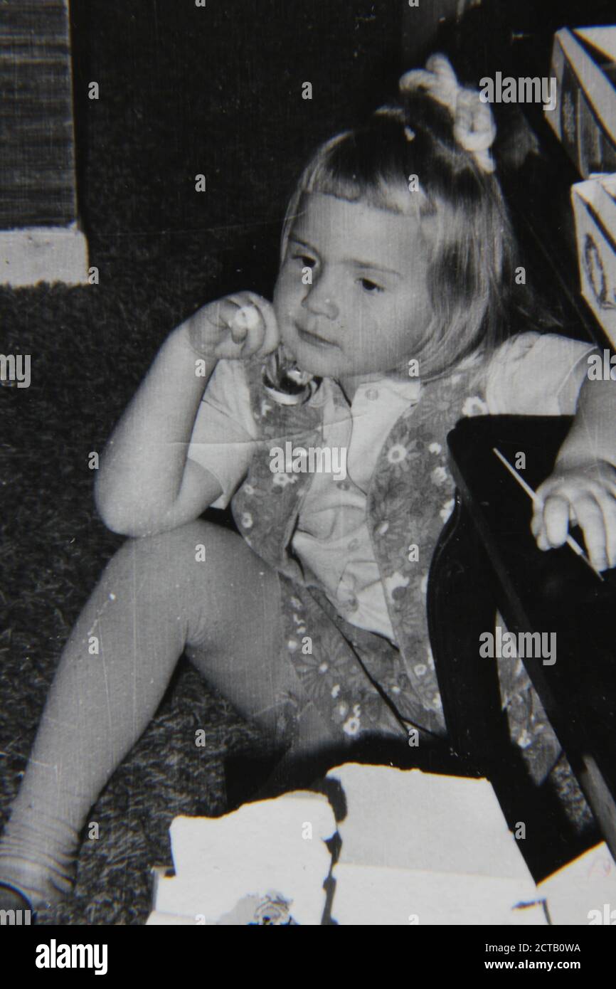 Fine 1970s black and white photography of a young girl lounging at home ...