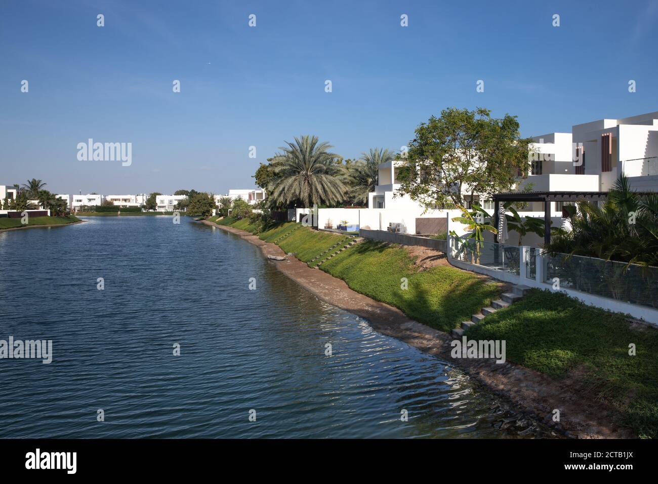 Al Mouj,Villas along waterways in compound. Al Mouj, The Wave, Muscat, Oman Stock Photo - Alamy