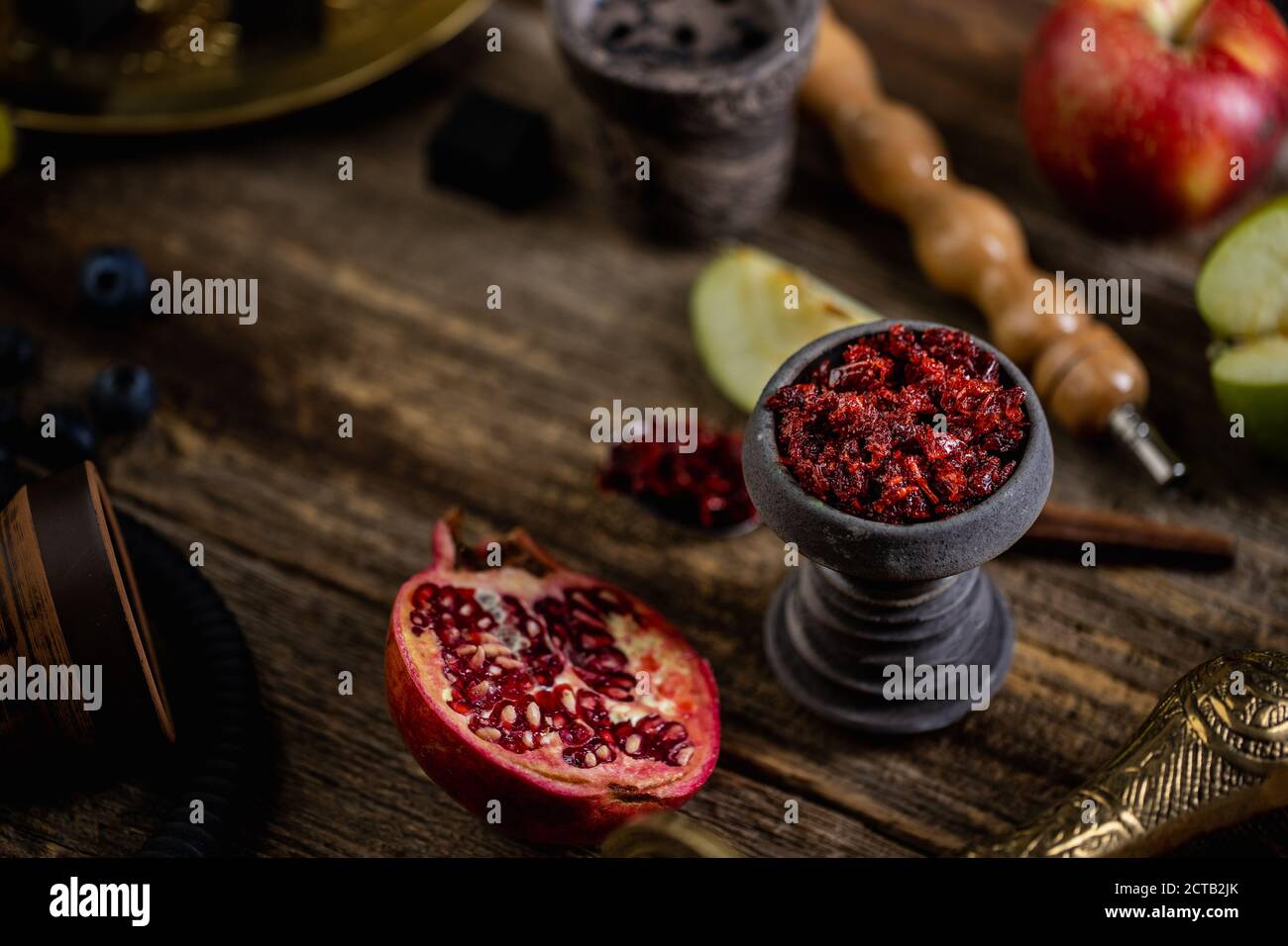 Arabian stone hookah head filled with apple and pomegranade flavoured ...