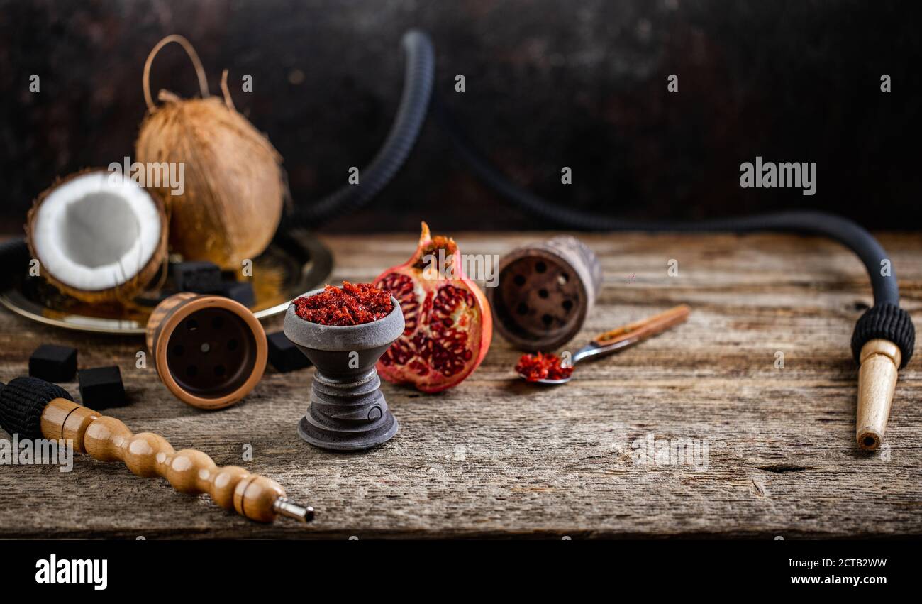 Arabian stone hookah head filled with pomegranade flavoured tobacco ...