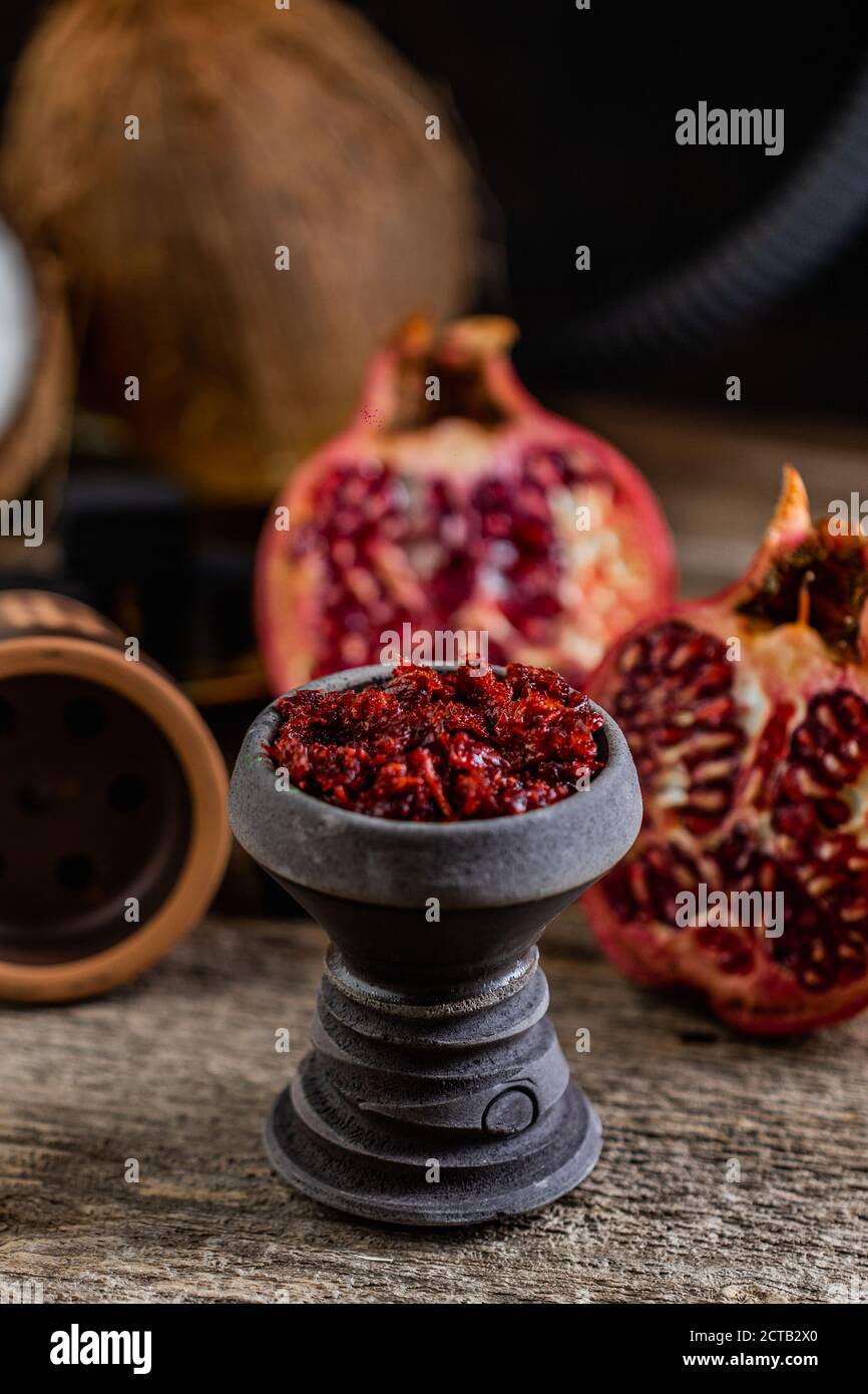 Arabian stone hookah head filled with pomegranade flavoured tobacco ...