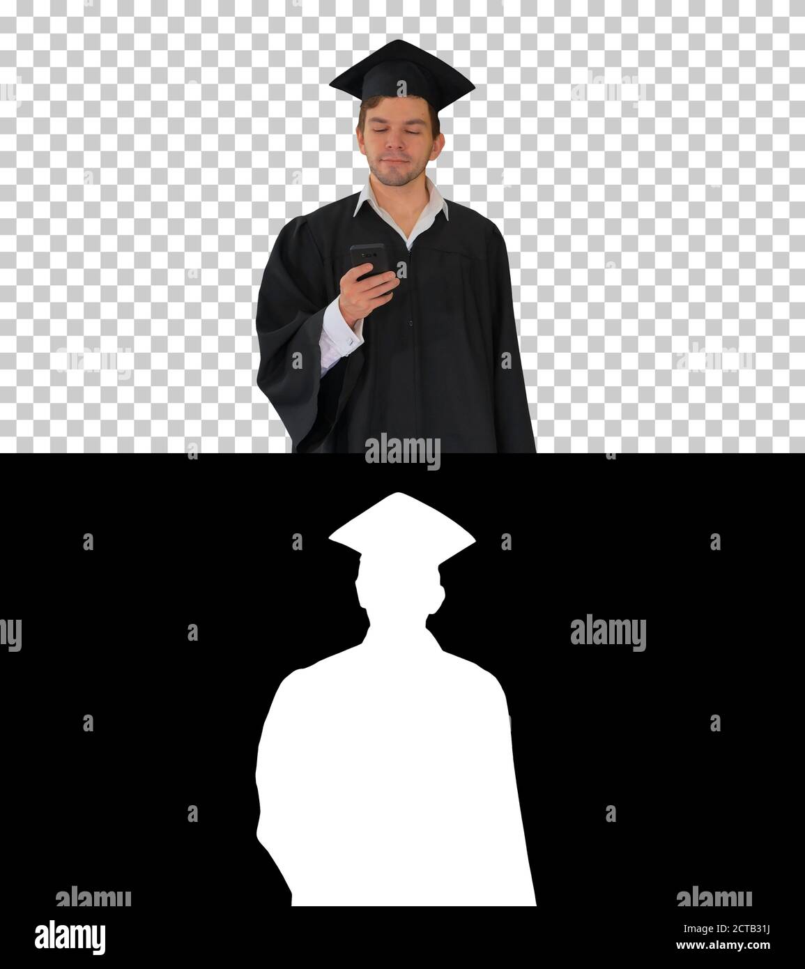 Male student in graduation gown checking his phone while walking Stock ...