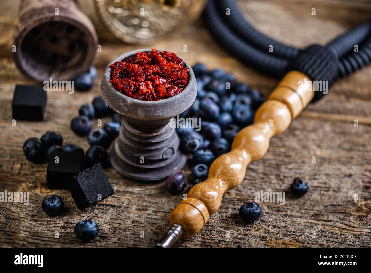 Arabian stone hookah head filled with blueberry flavoured tobacco Stock ...