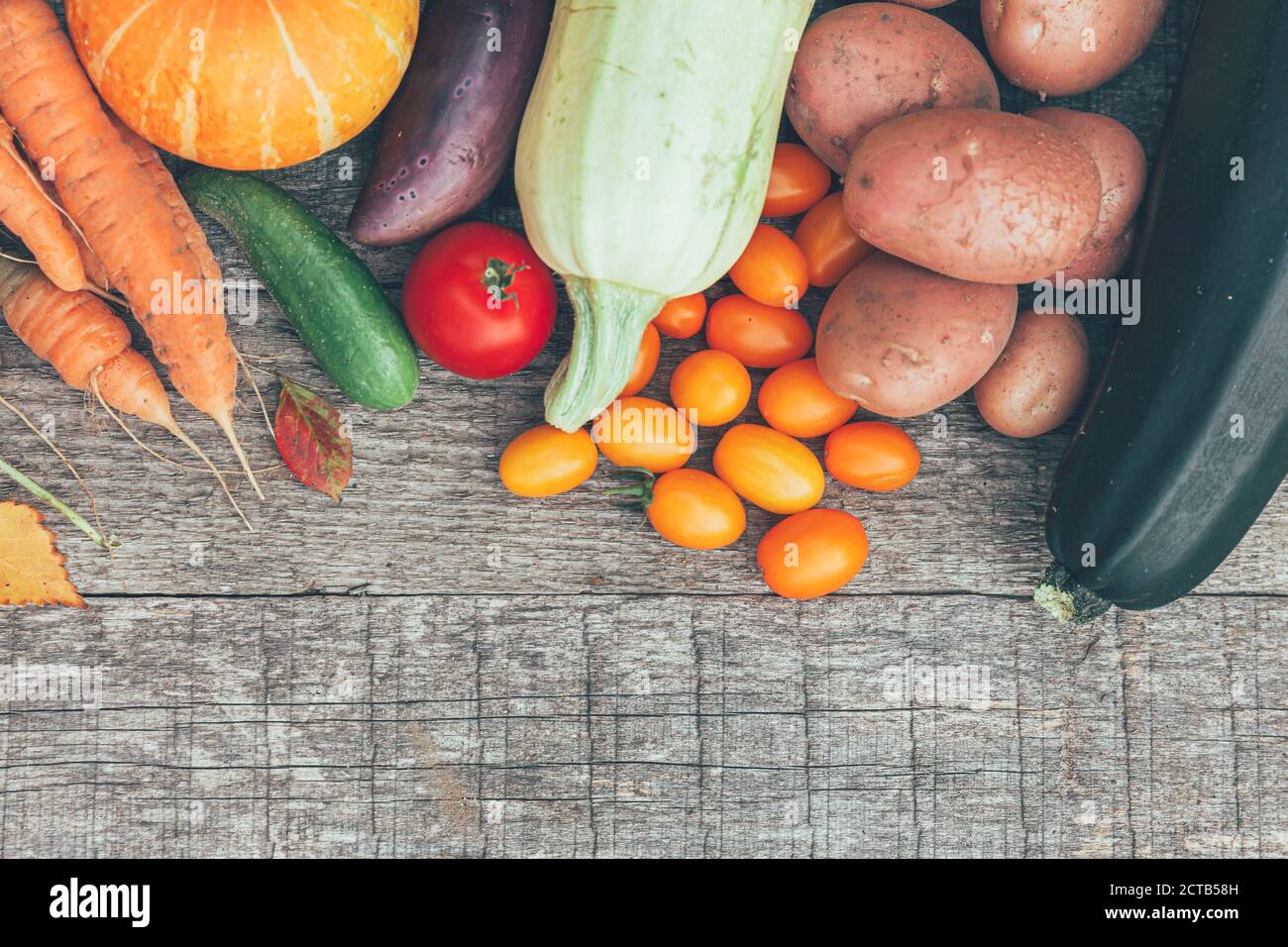 Assortment different fresh organic vegetables on country style wooden ...