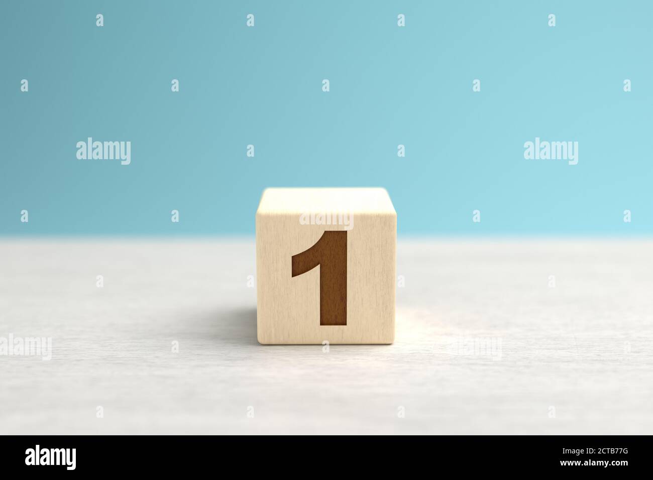 A wooden toy cube with the number 1 Stock Photo - Alamy