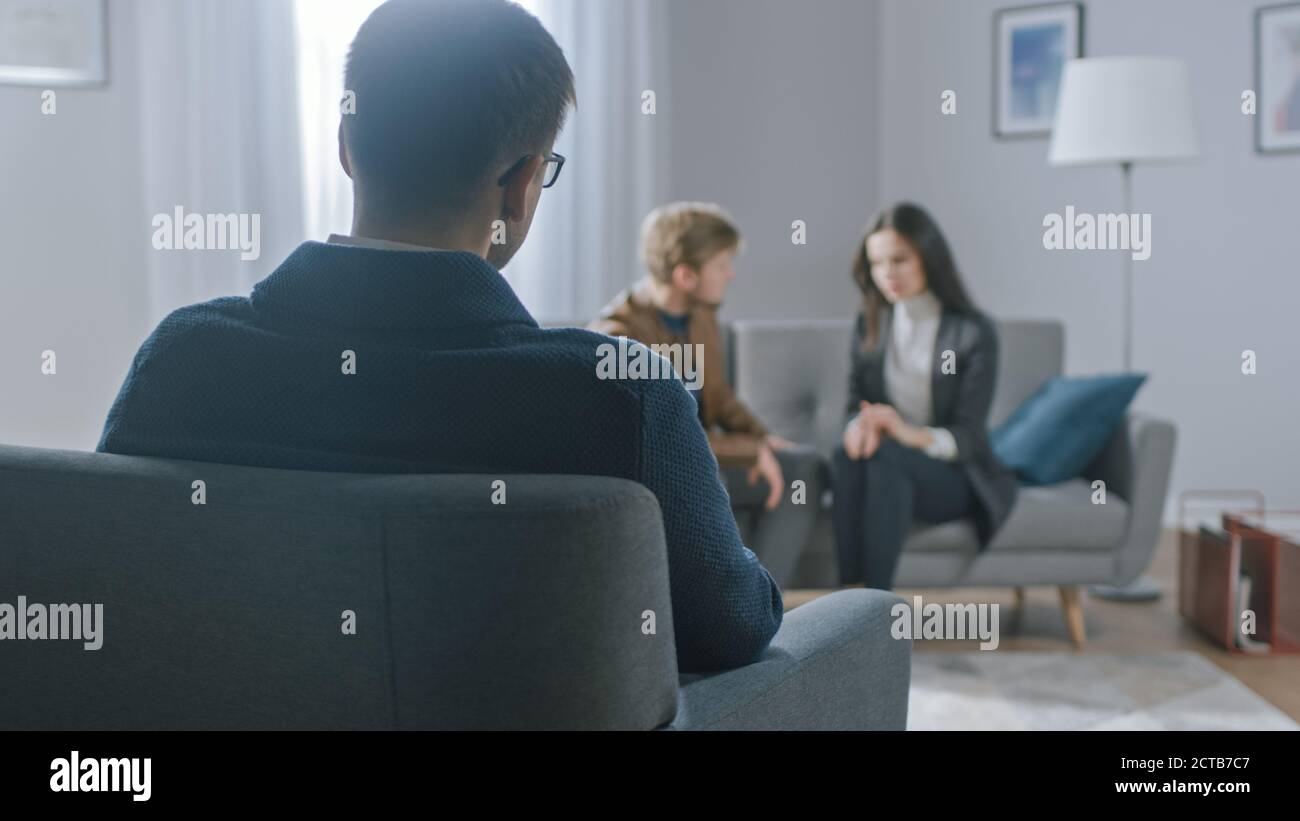 Unfocused Couple on Counseling Session with Psychotherapist. Focus on ...
