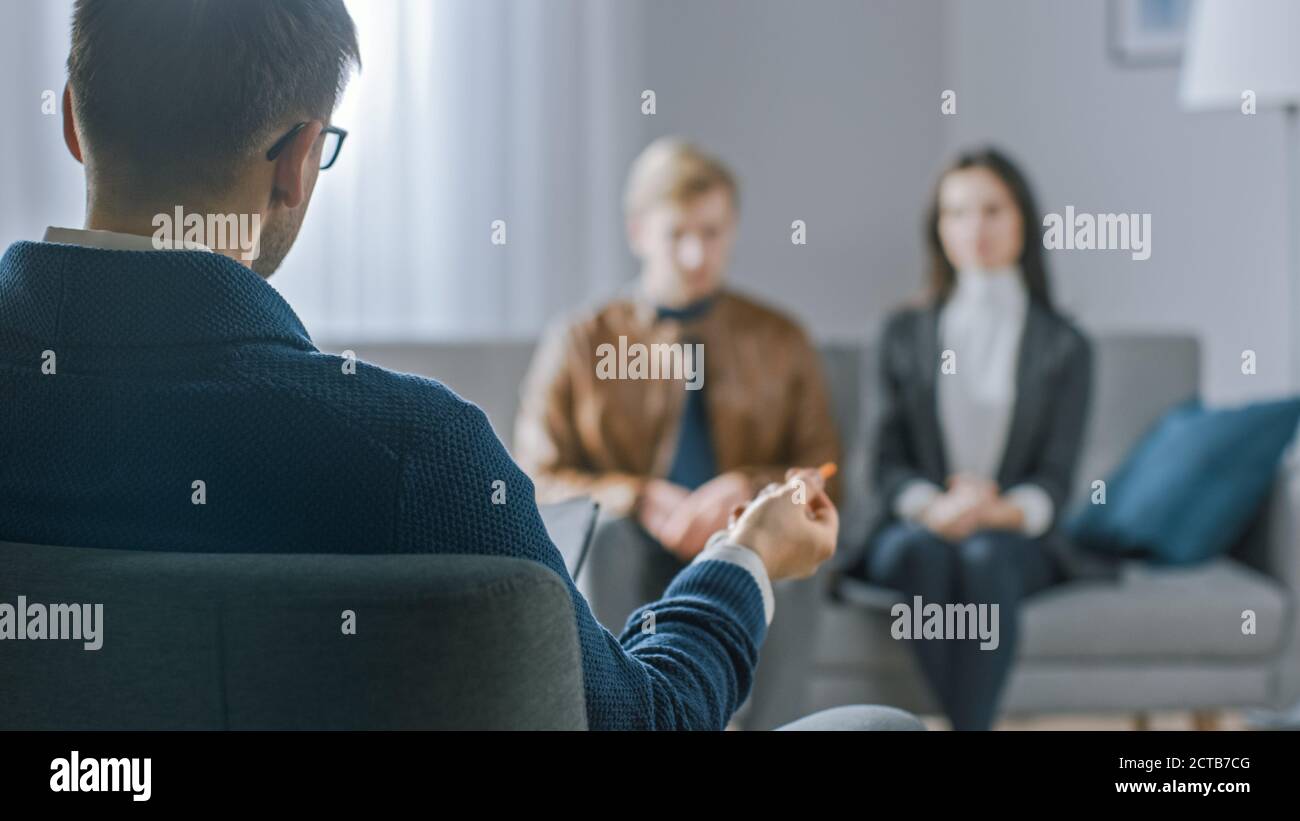 Unfocused Couple on Counseling Session with Psychotherapist. Focus on ...