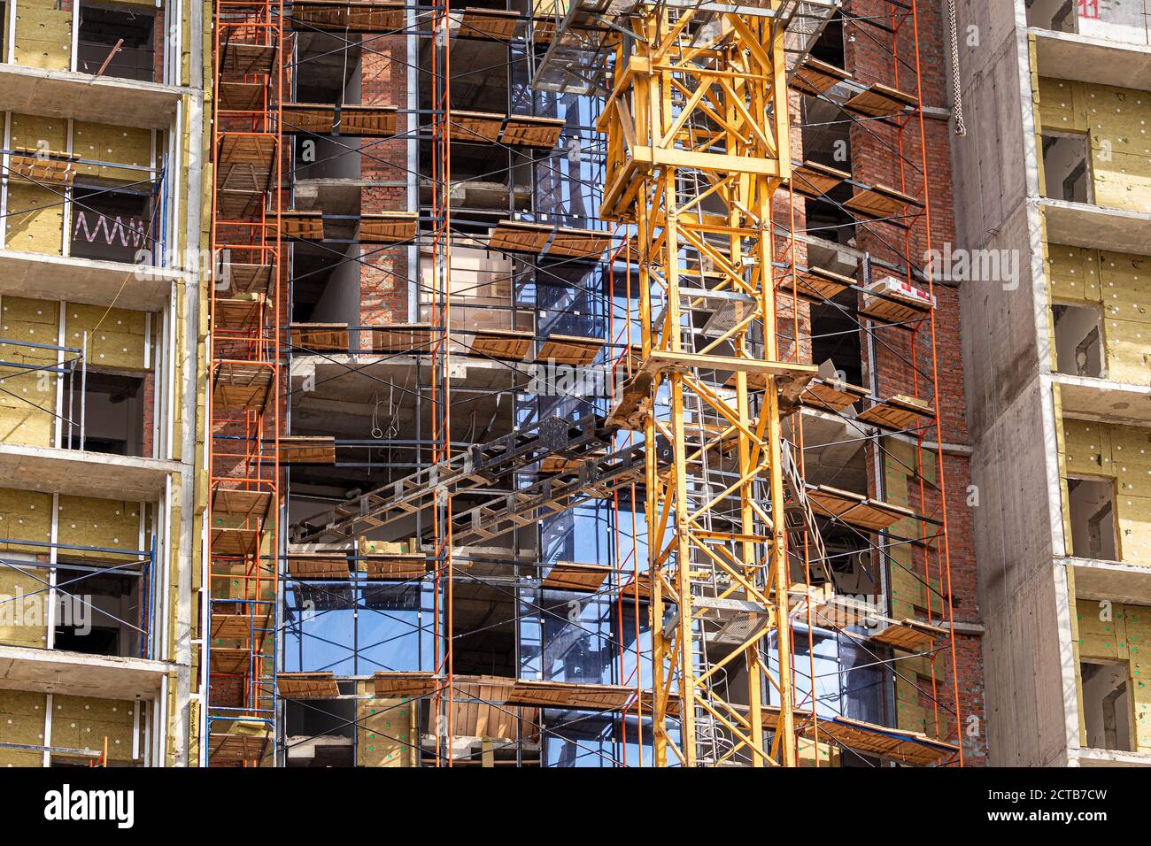 Fragment of an unfinished concrete and brick building under ...