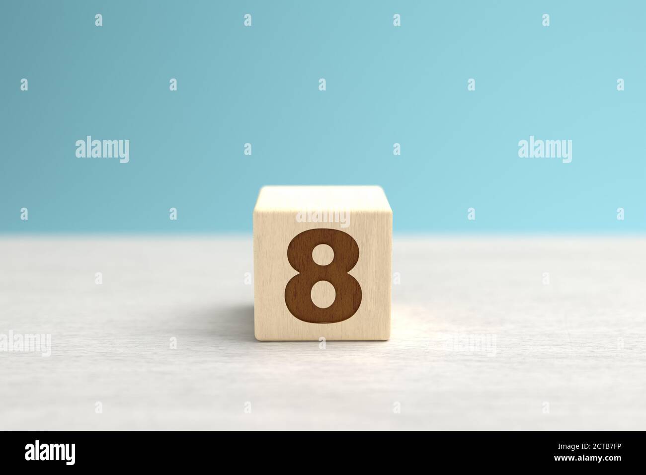 A wooden toy cube with the number 8 Stock Photo - Alamy