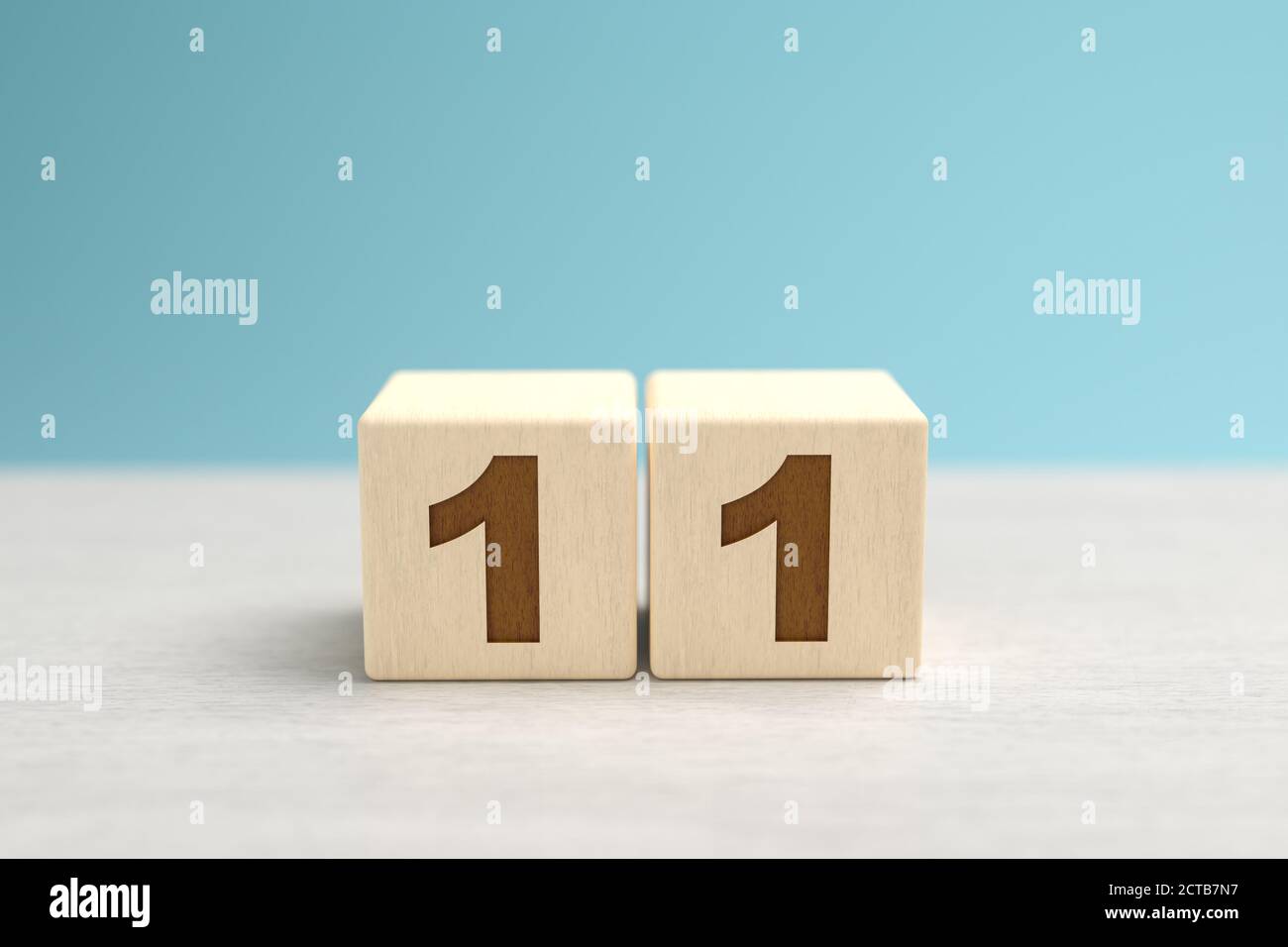 Wooden toy blocks forming the number 11 Stock Photo - Alamy
