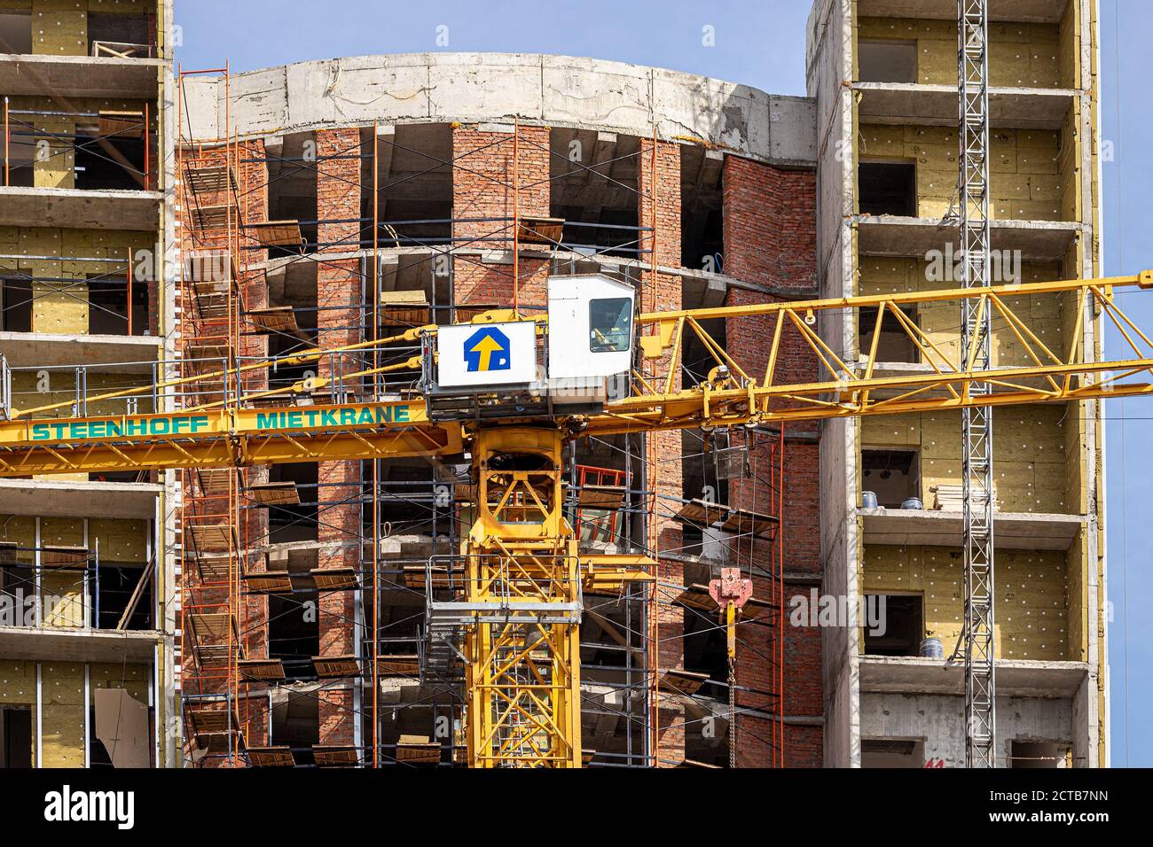 Fragment of an unfinished concrete and brick building under ...