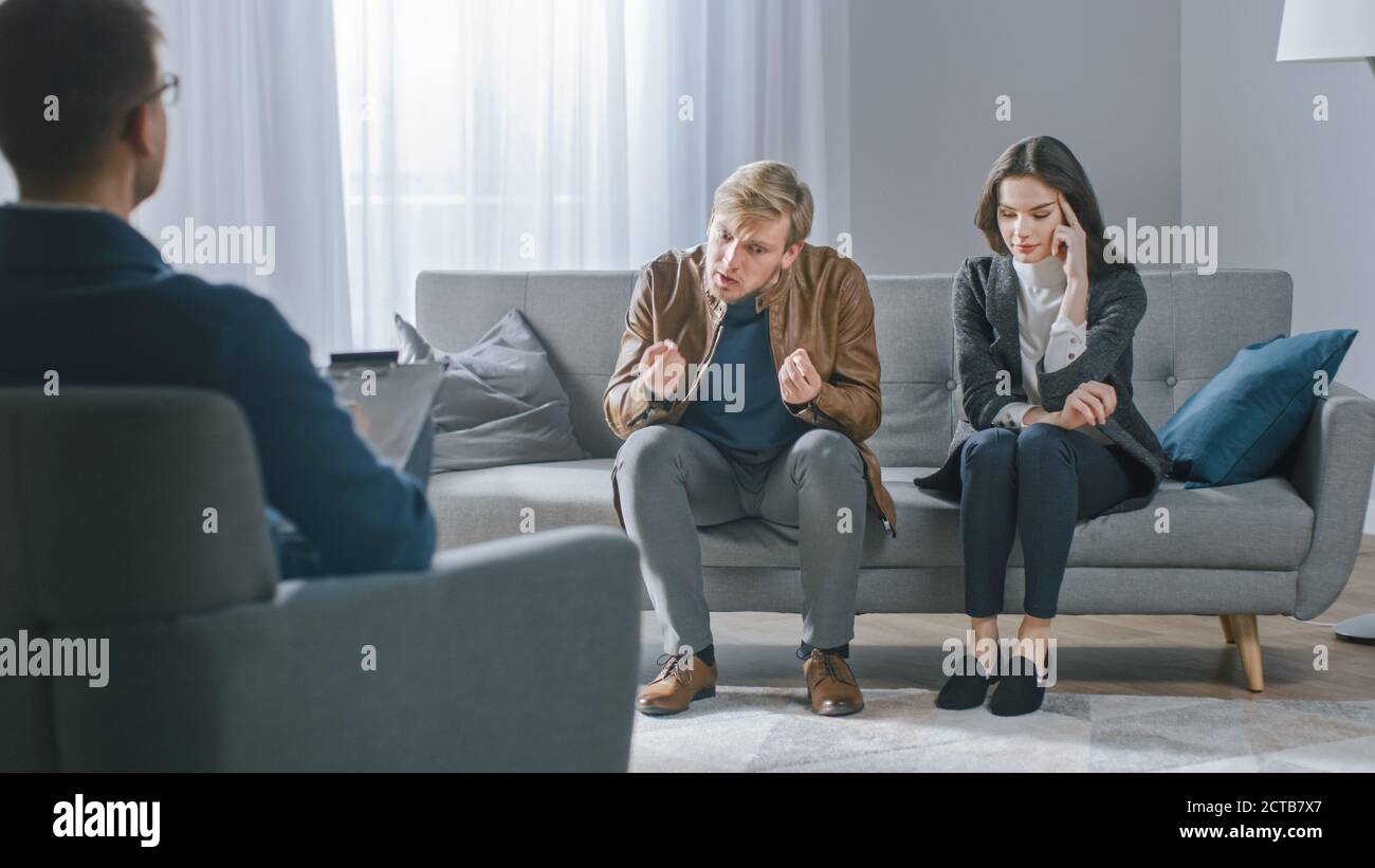 Young Couple on Counseling Session with Psychotherapist. Back View of ...