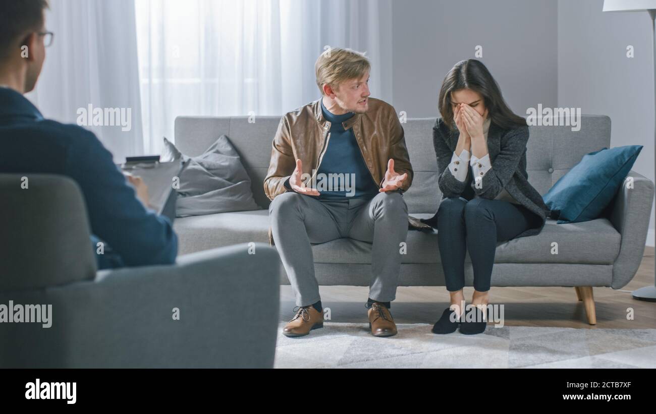 Young Couple on Counseling Session with Psychotherapist. Back View of ...