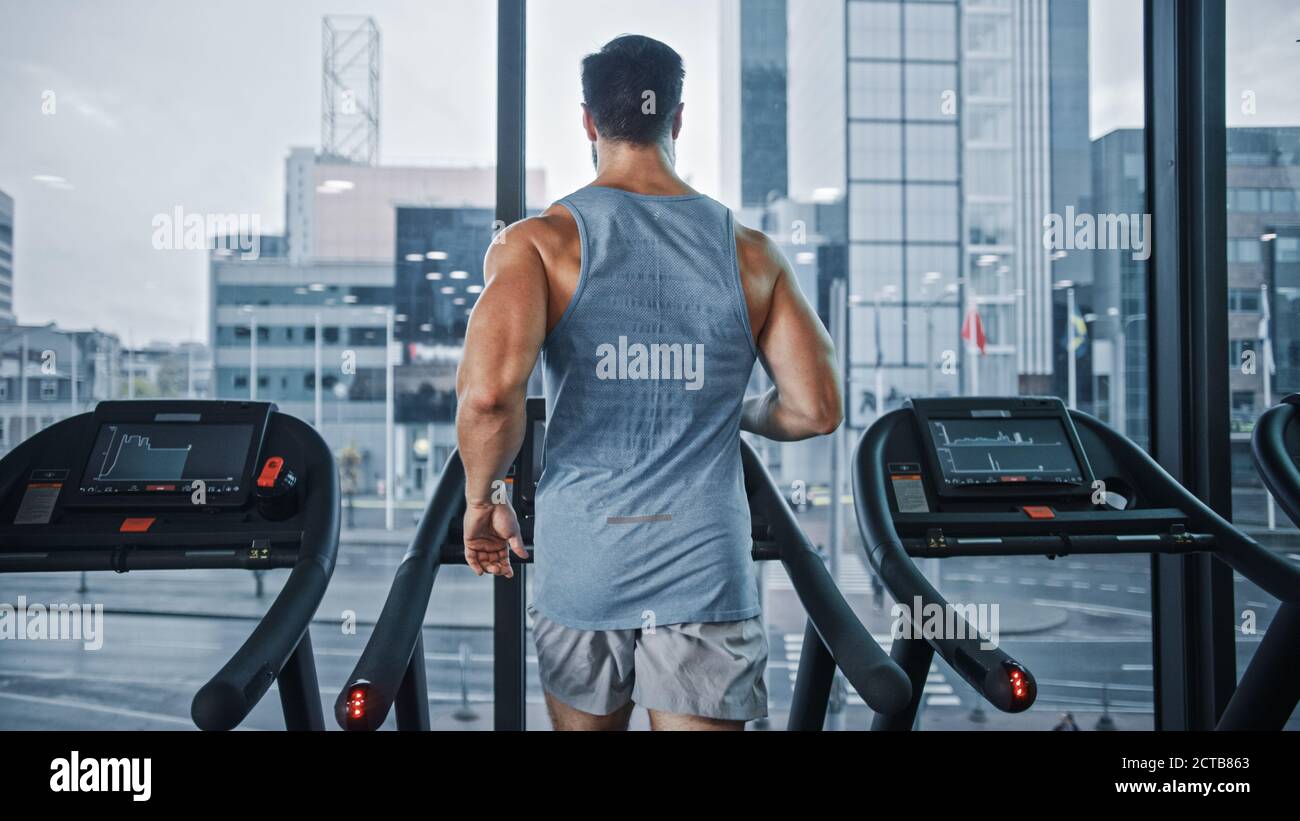 Athletic Muscular Man Running on a Treadmill, Leg and Cardio Day ...