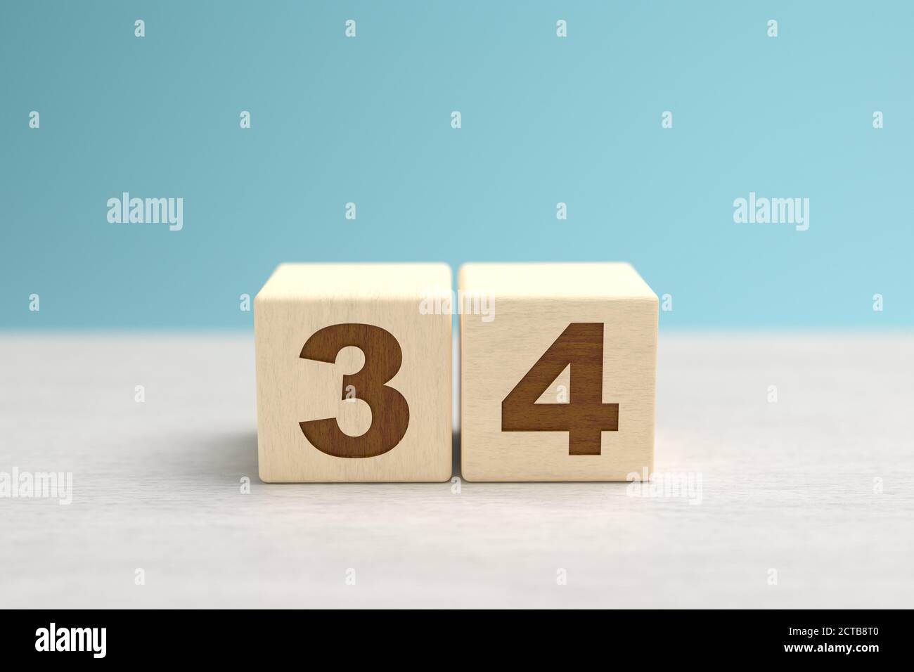 Wooden toy blocks forming the number 34 Stock Photo - Alamy
